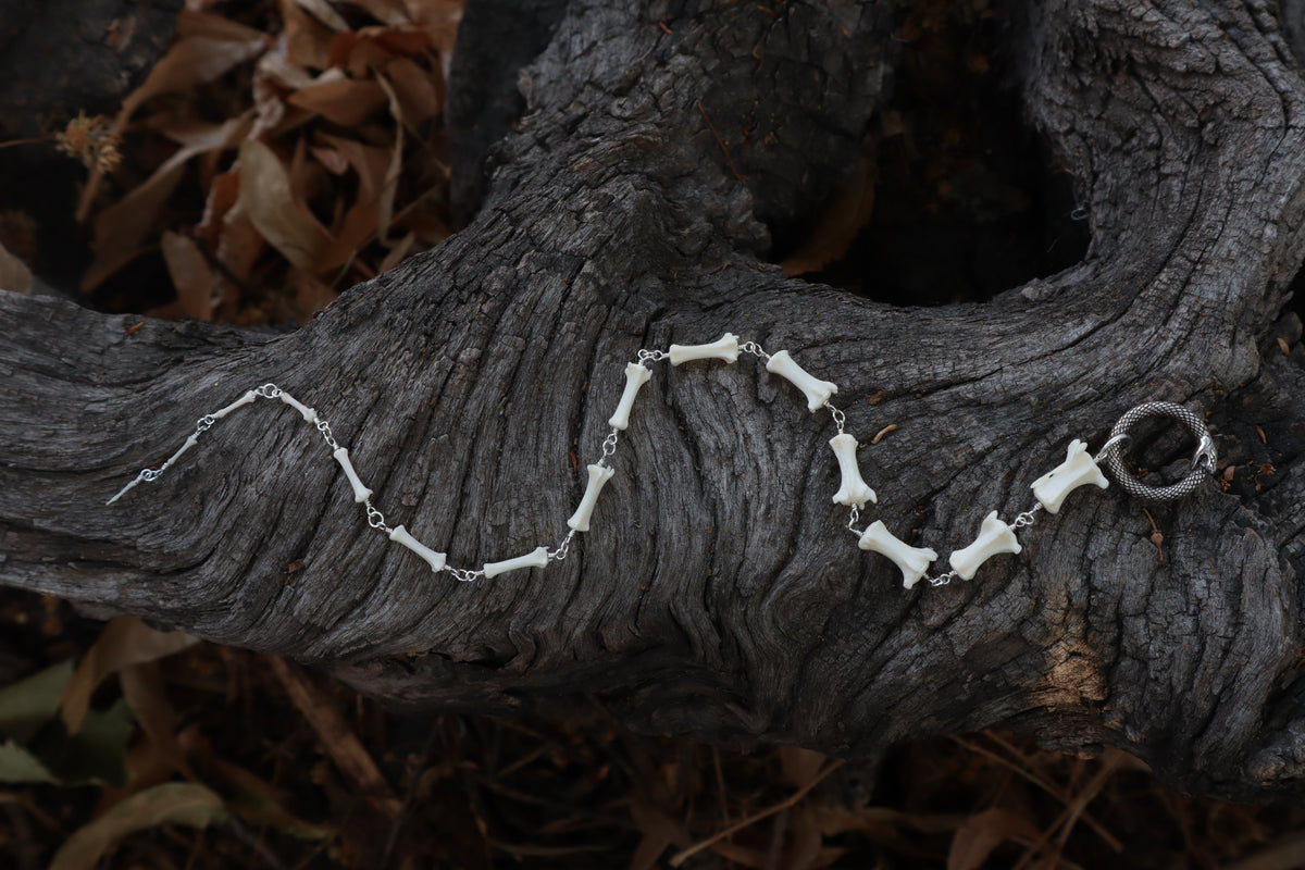 Fluid Striped Skunk Tail Articulation with Ouroboros Ring – Freyja's Forest